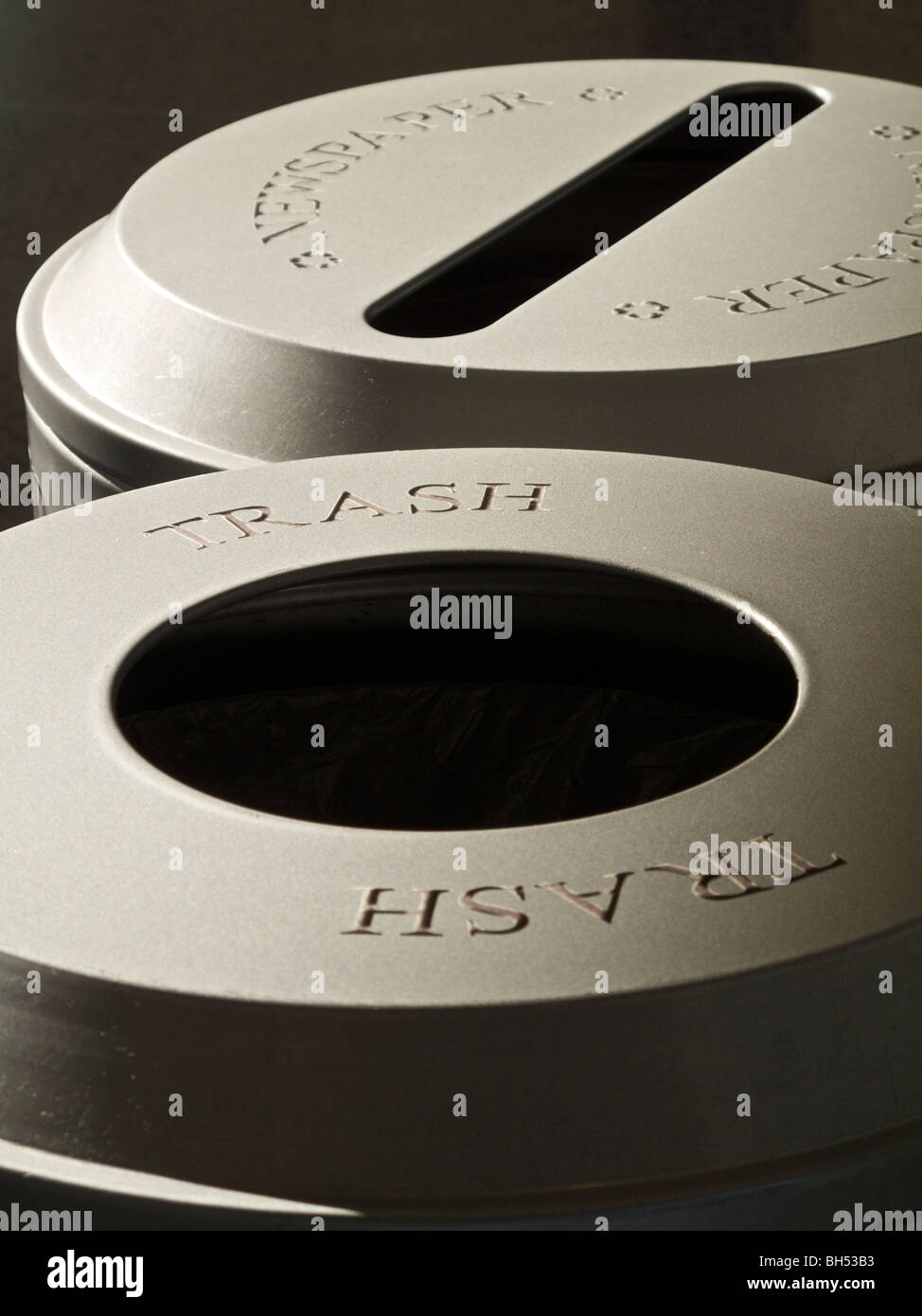 Trash and newspaper recycling containers Stock Photo - Alamy