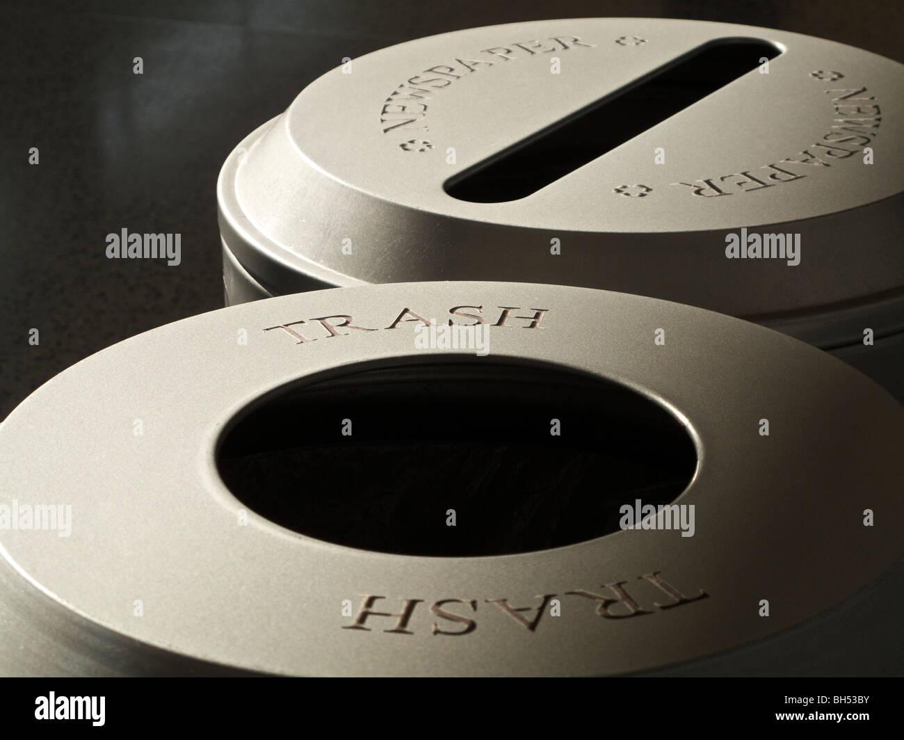 Trash and newspaper recycling containers Stock Photo - Alamy