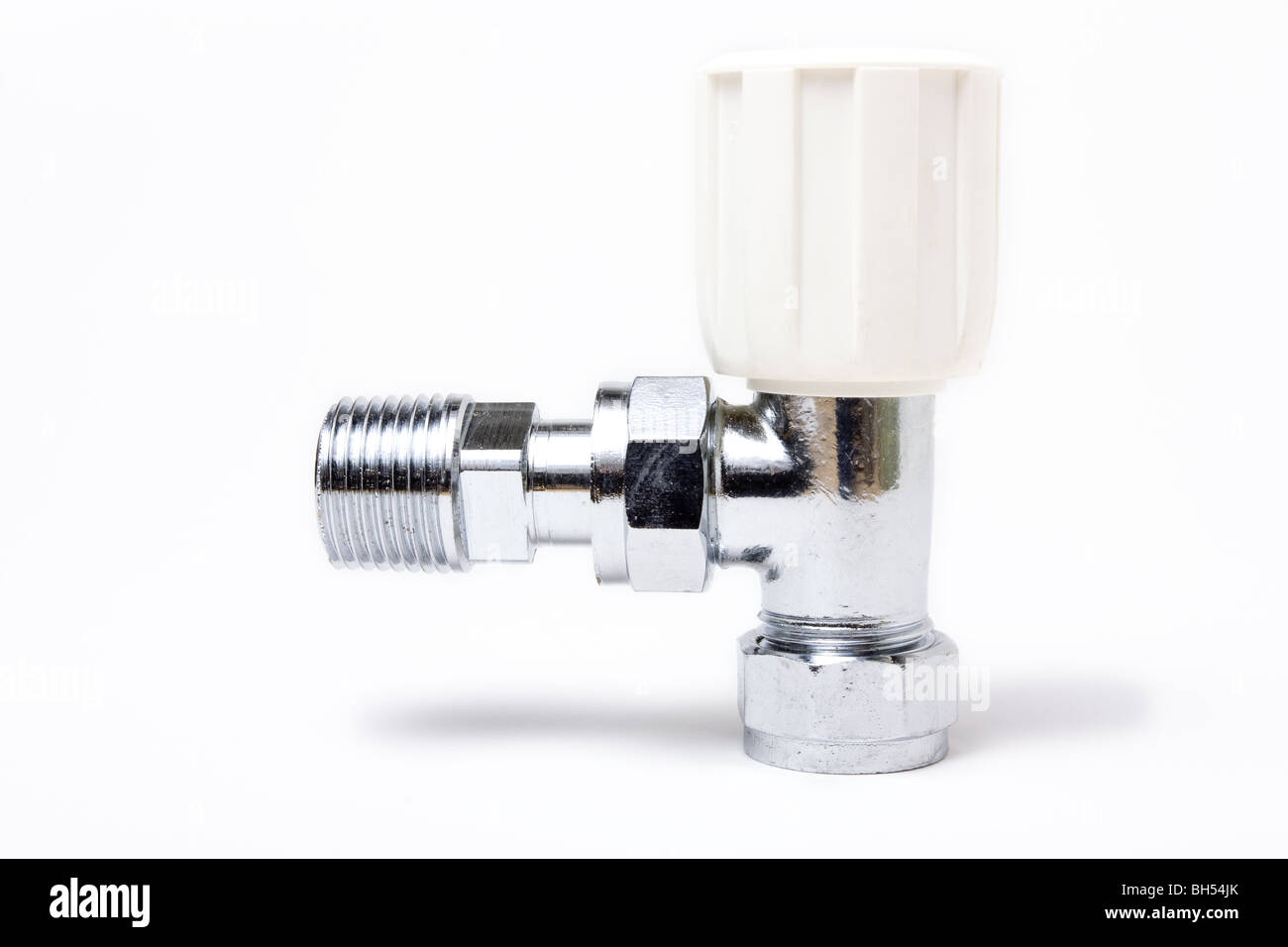 Domestic central heating radiator valve isolated against white ...