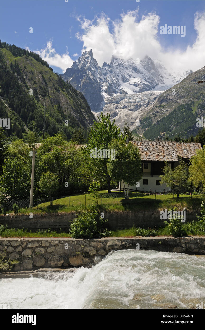 Peaks Aiguille Noire de Peuterey and Mont Blanc traditional tiled house ...