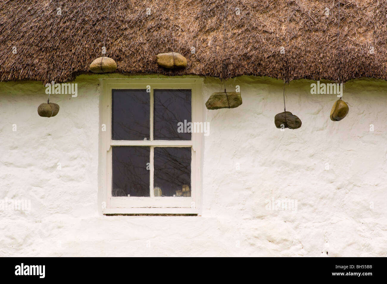 Traditional thatched crofting cottage at Luib, Isle of Skye, window ...