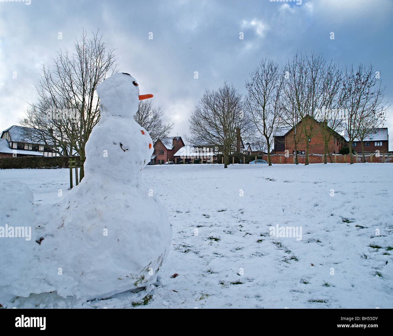 Snowman in housing estate Norfolk England UK Stock Photo - Alamy