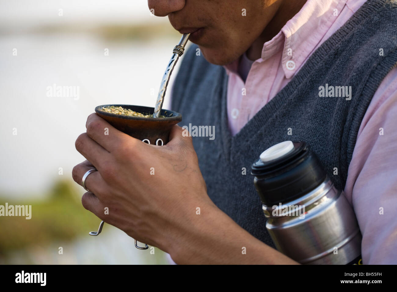 Single man drinking mate Stock Photo - Alamy