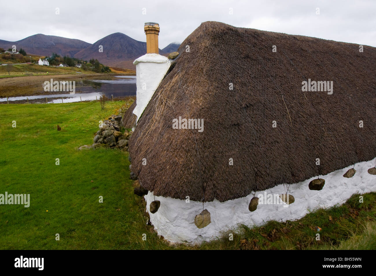 Traditional thatched crofting cottage at Luib, looking to the Red ...