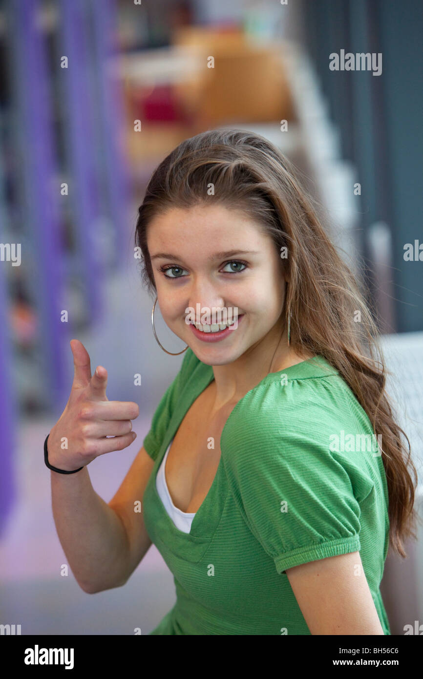 Portarit of a teenage girl making a gesture Stock Photo - Alamy