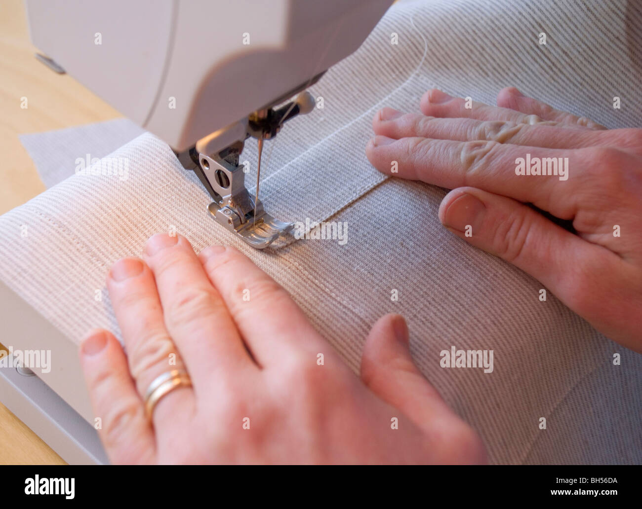 Working with a sewing machine Stock Photo - Alamy