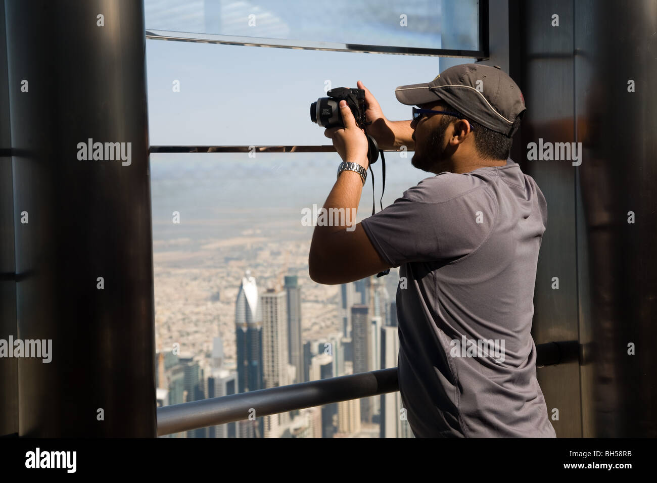 Tourist photographing from At The Top Viewing platform gallery Burj ...