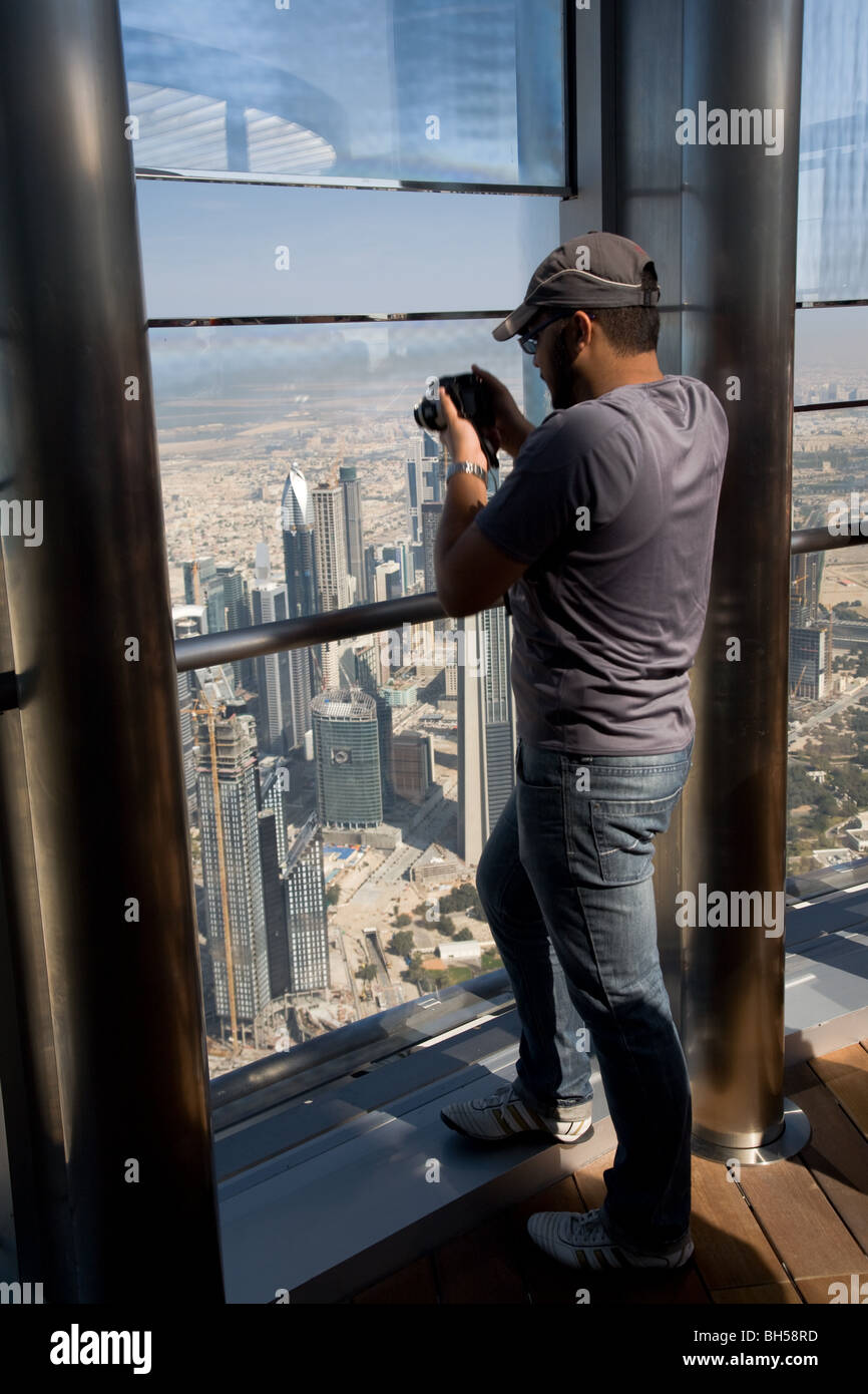 Tourist photographing from At The Top Viewing platform gallery Burj ...