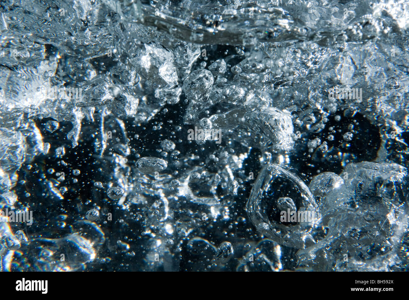 Water boiling in a glass container Stock Photo - Alamy