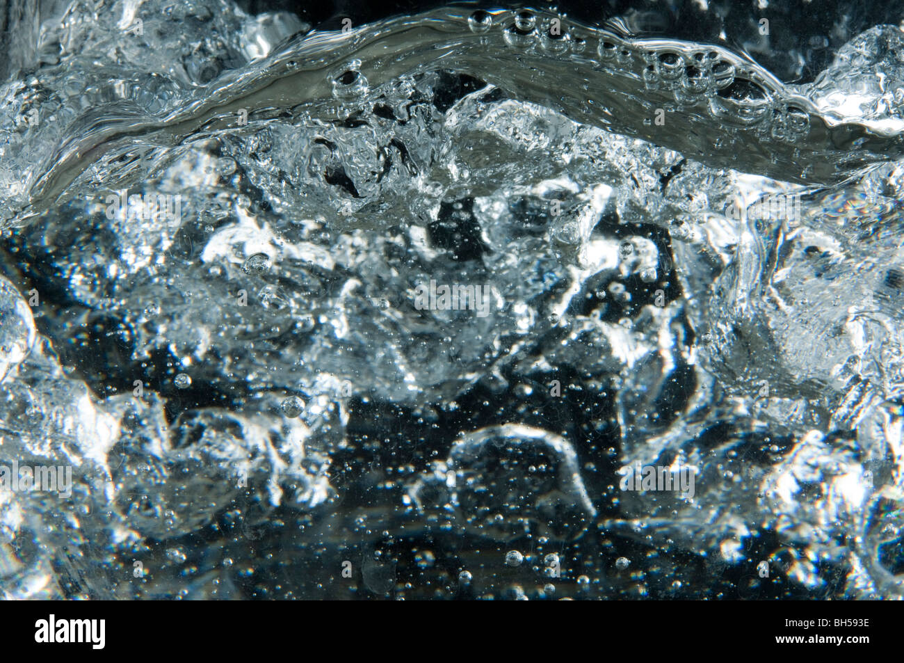 Water boiling in a glass container Stock Photo - Alamy