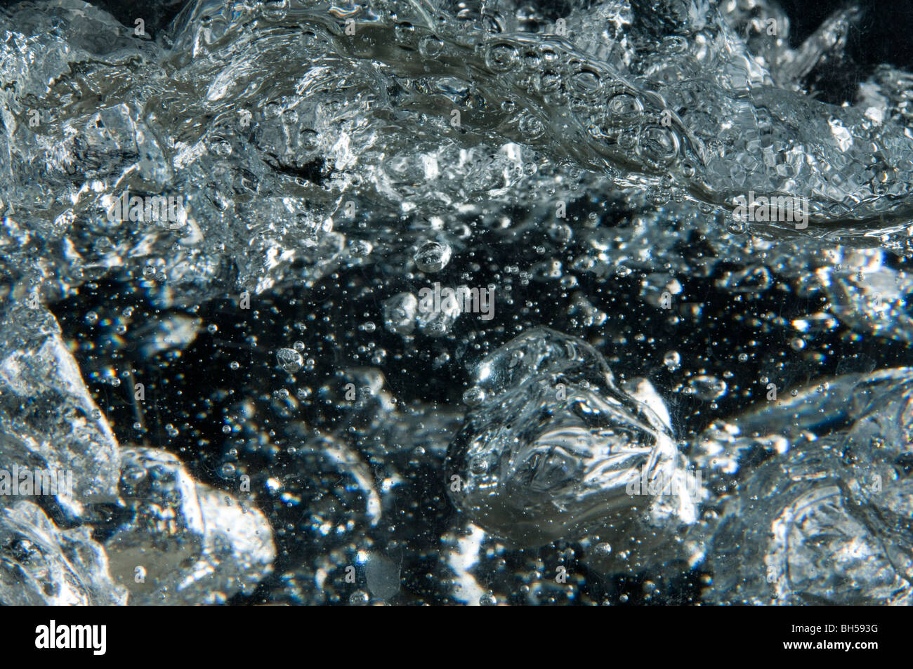 Water boiling in a glass container Stock Photo - Alamy