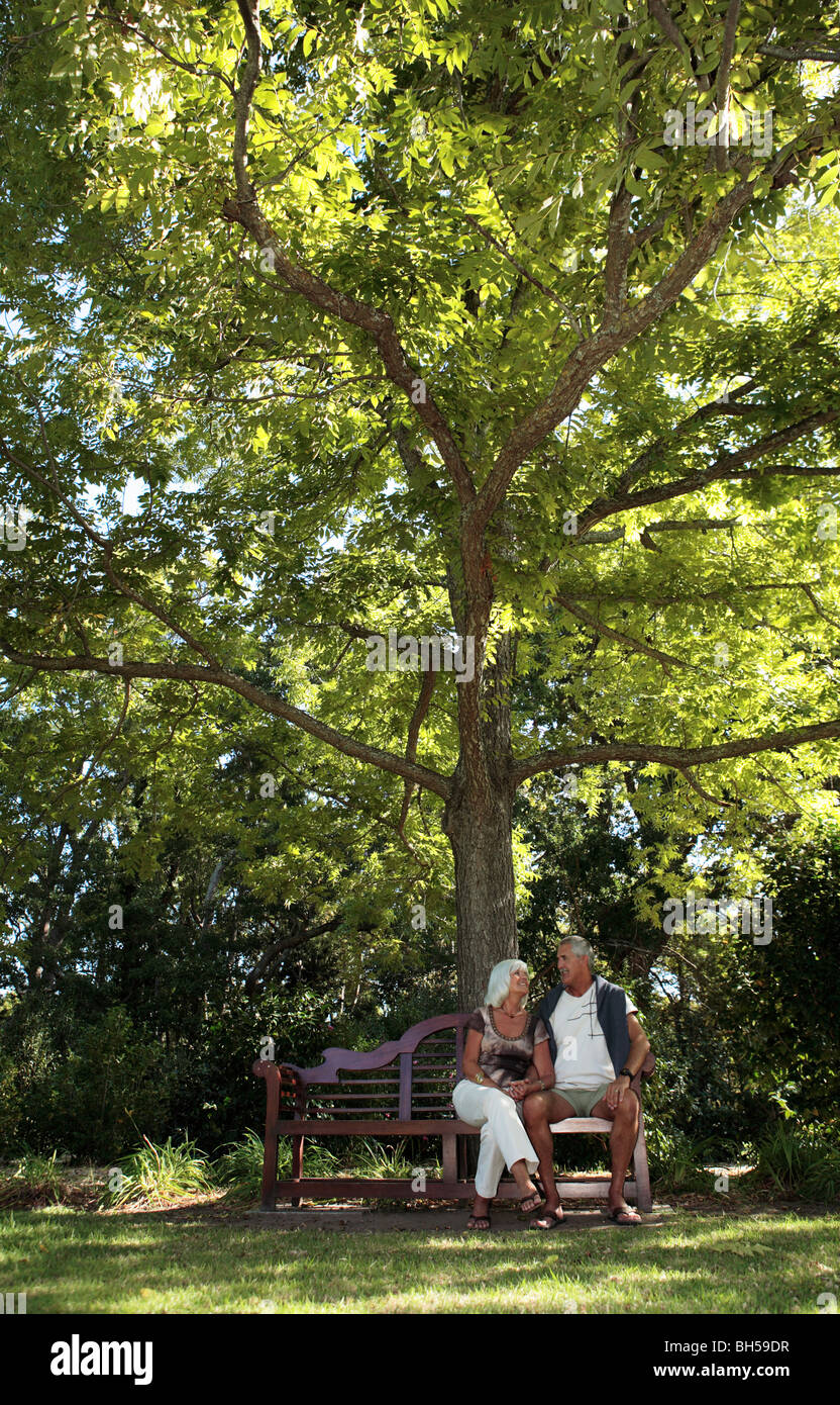 Mature couple under tree Stock Photo - Alamy