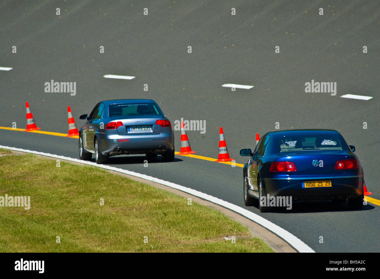 Two cars, Audi A4 and VW Phaeton on test track at Michelin Challenge ...