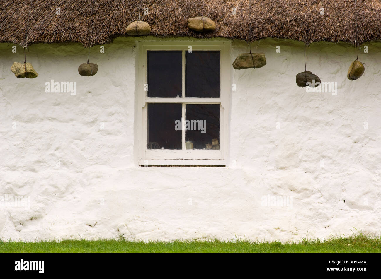 Traditional thatched crofting cottage at Luib, Isle of Skye, window ...