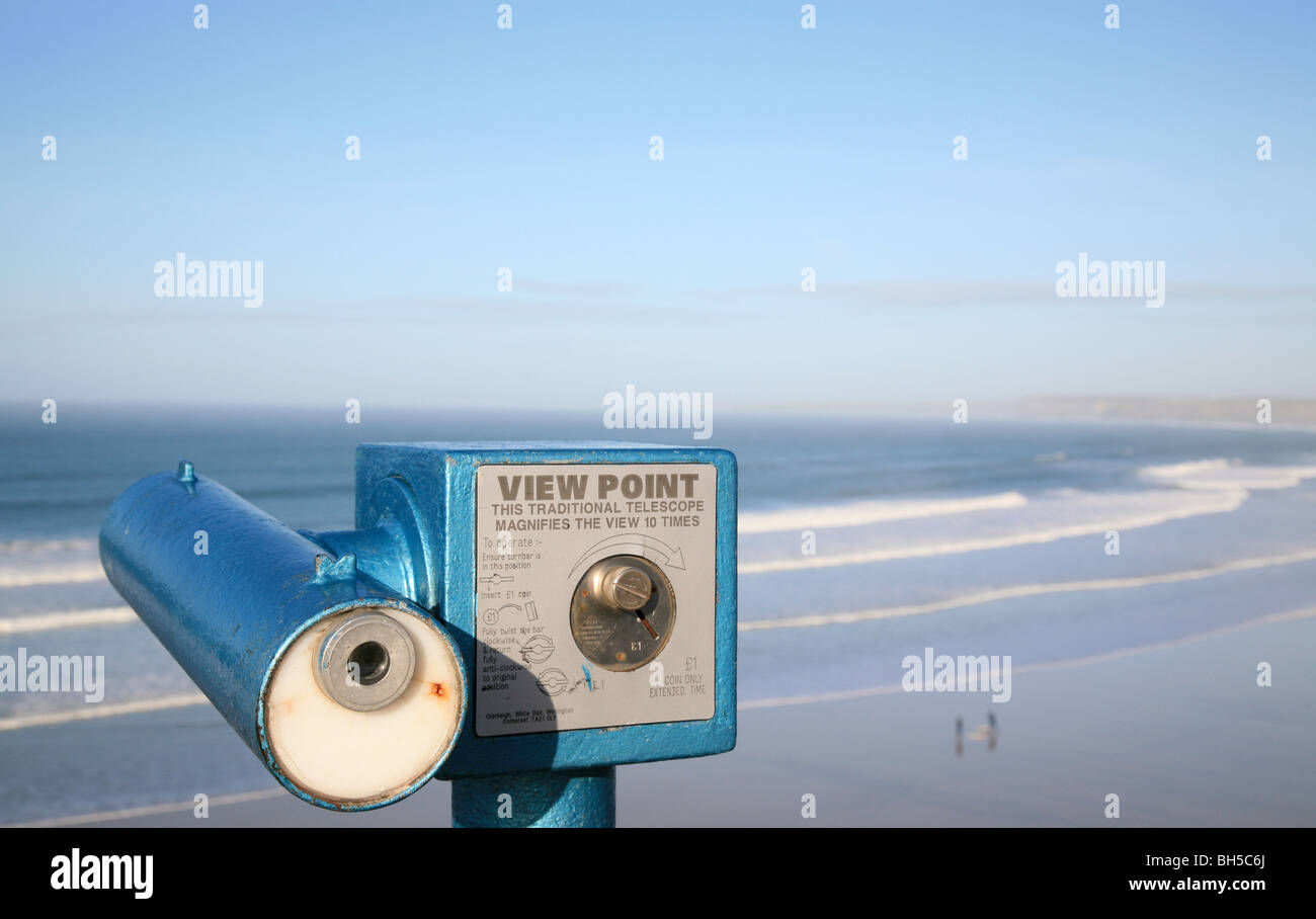Public telescope with Newquay beaches in the background, surfers ...