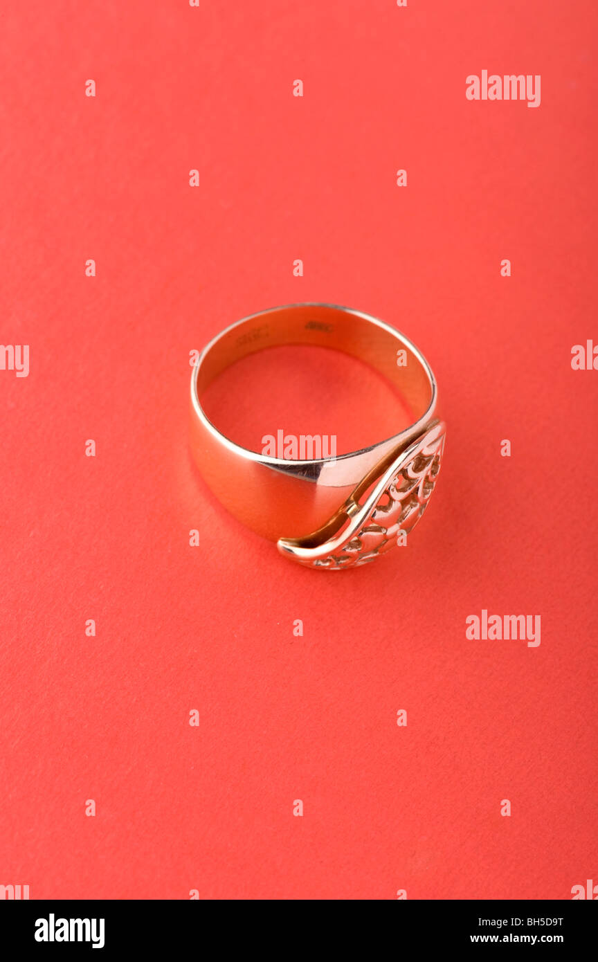 object on red - Gold ring close up Stock Photo - Alamy