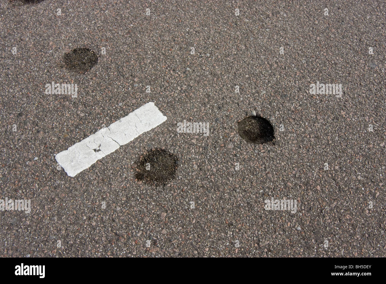 Asphalt sampling holes Stock Photo - Alamy