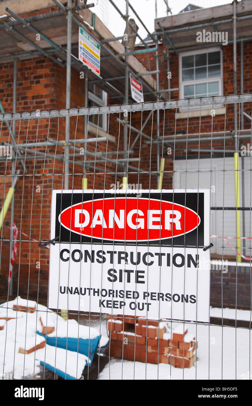 Warning sign on building site Stock Photo - Alamy