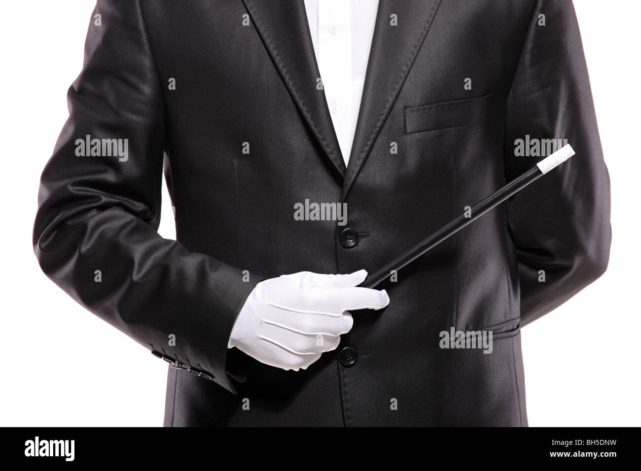 Magician holding a magic wand, isolated on white background Stock Photo ...