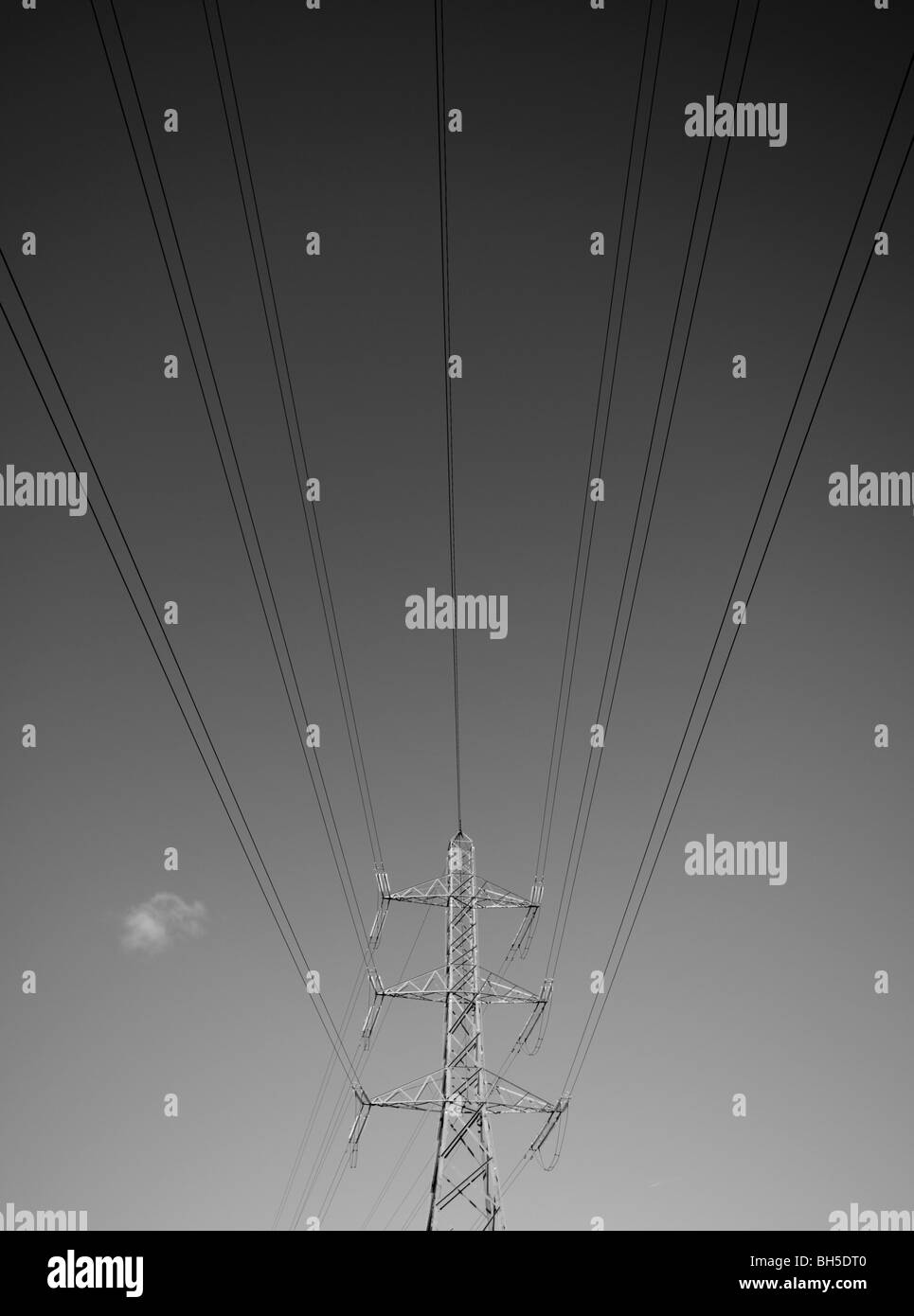 Electricity pylon, cables and sky in monotone Stock Photo - Alamy