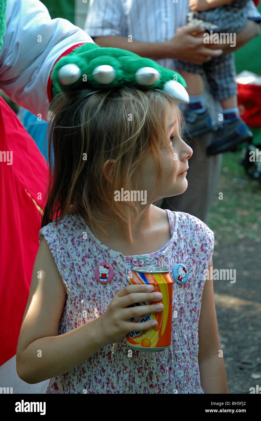 Little girl being patted on the head by Gunnersaurus at the Gillespie ...