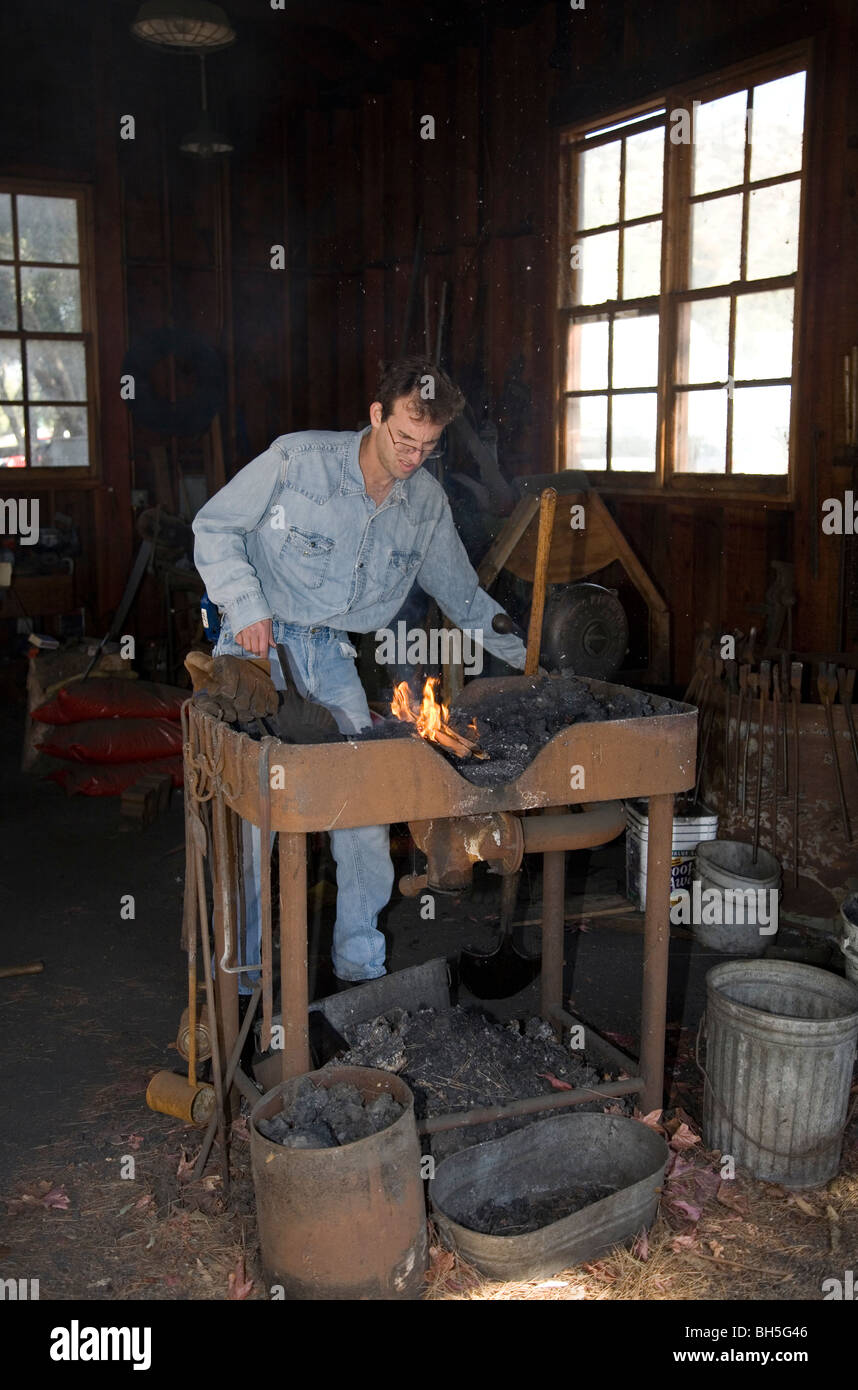 Blacksmith starting coal fire, Old Poway Park, Poway, California Stock ...