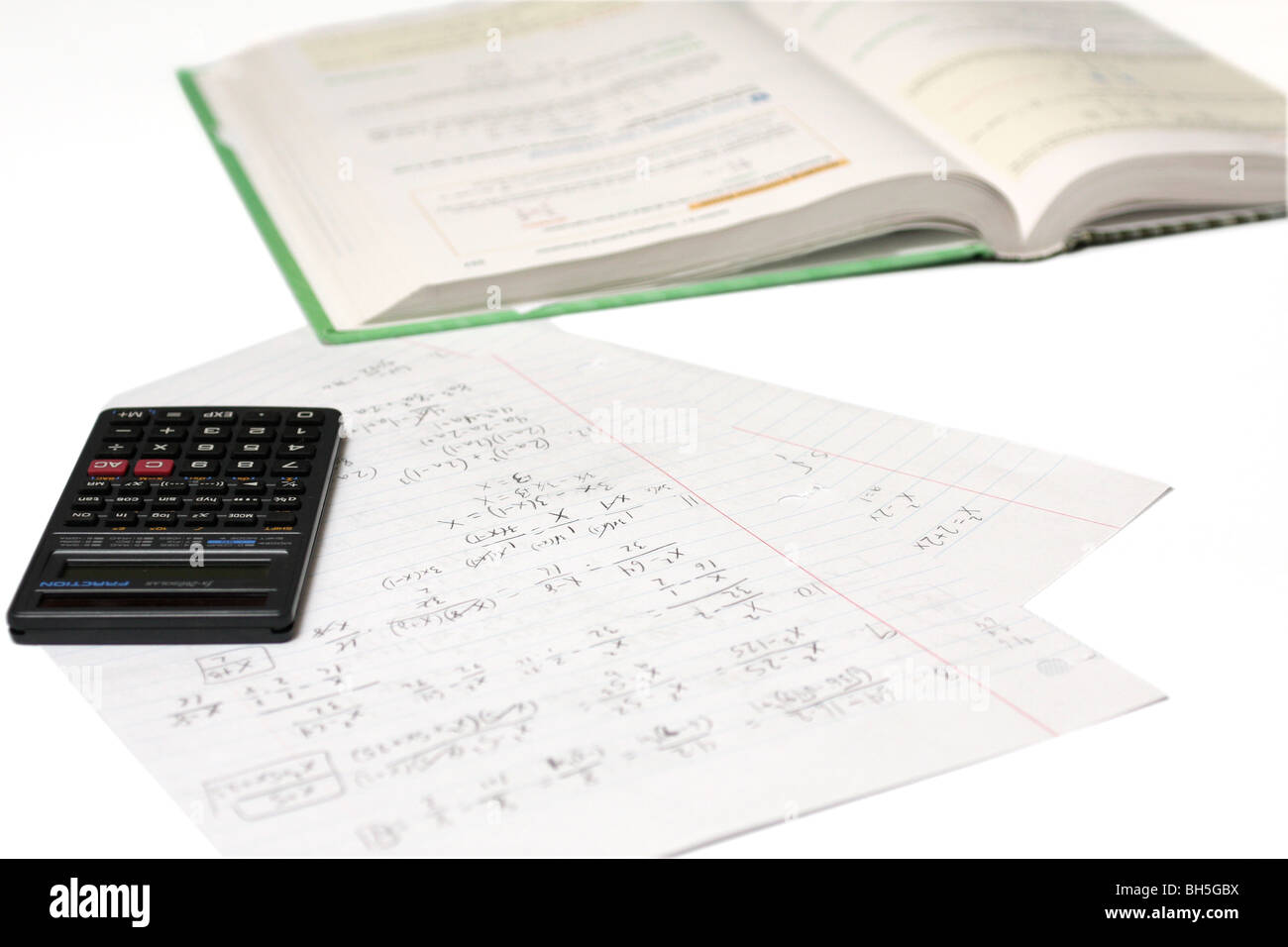 Math homework on white background Stock Photo - Alamy