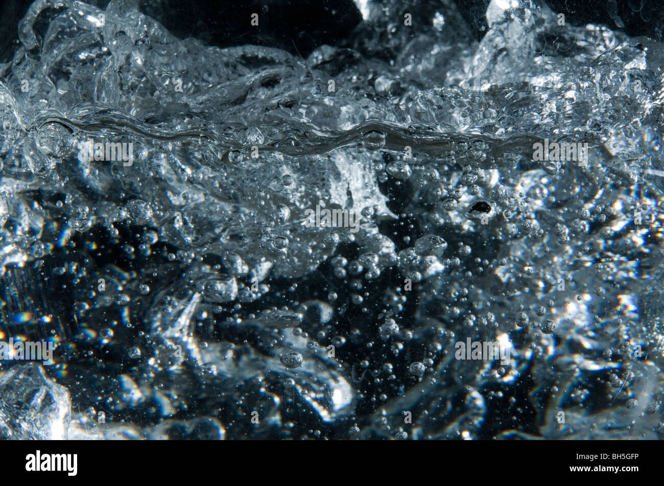 Water boiling in a glass container Stock Photo - Alamy