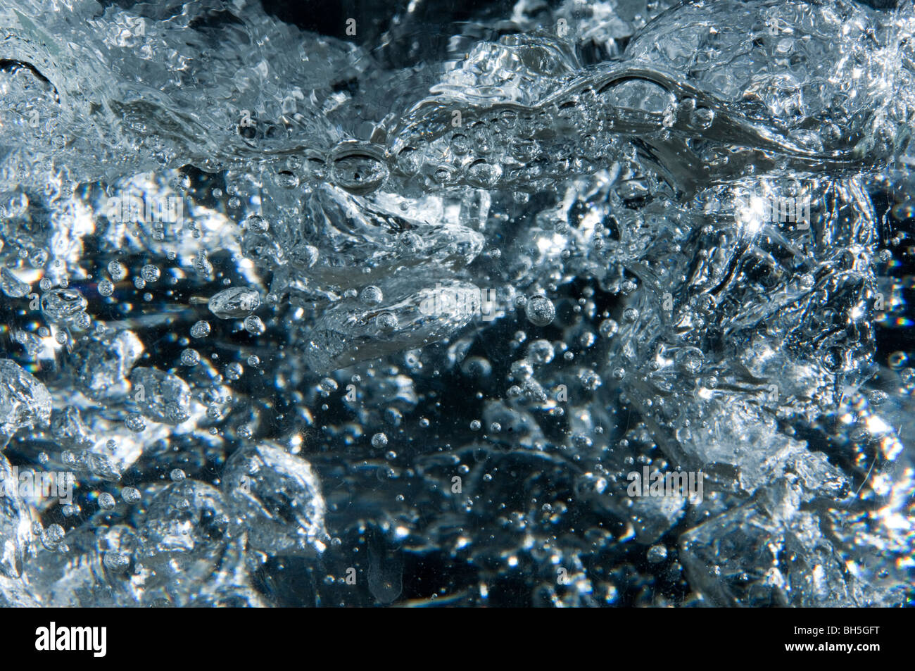 Water boiling in a glass container Stock Photo - Alamy