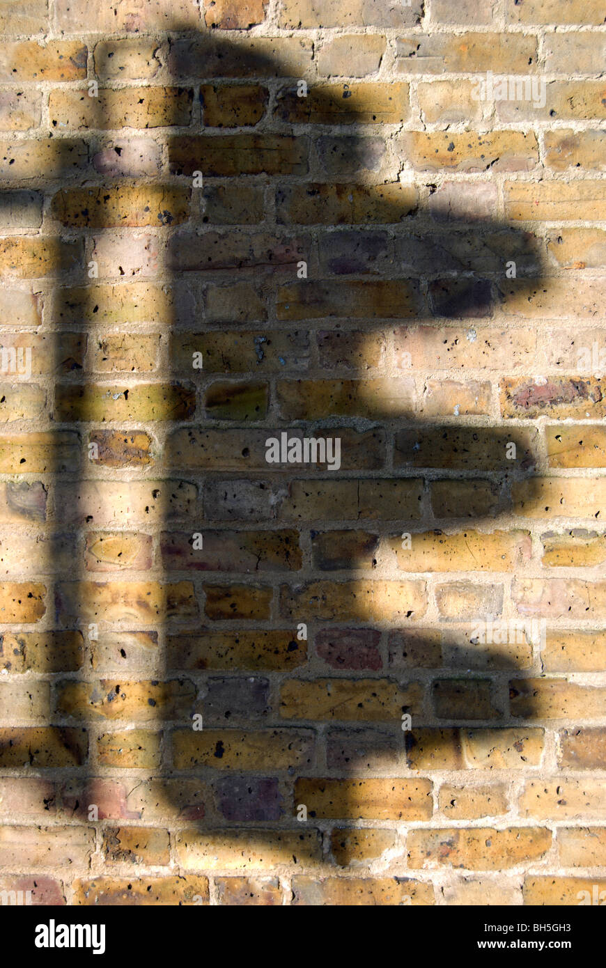 traffic light shadow on a brick wall, in kew, southwest london, england ...