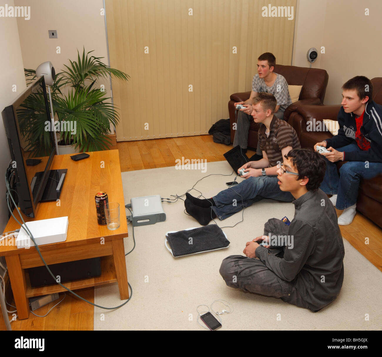 Four teenage boys computer gaming Stock Photo - Alamy