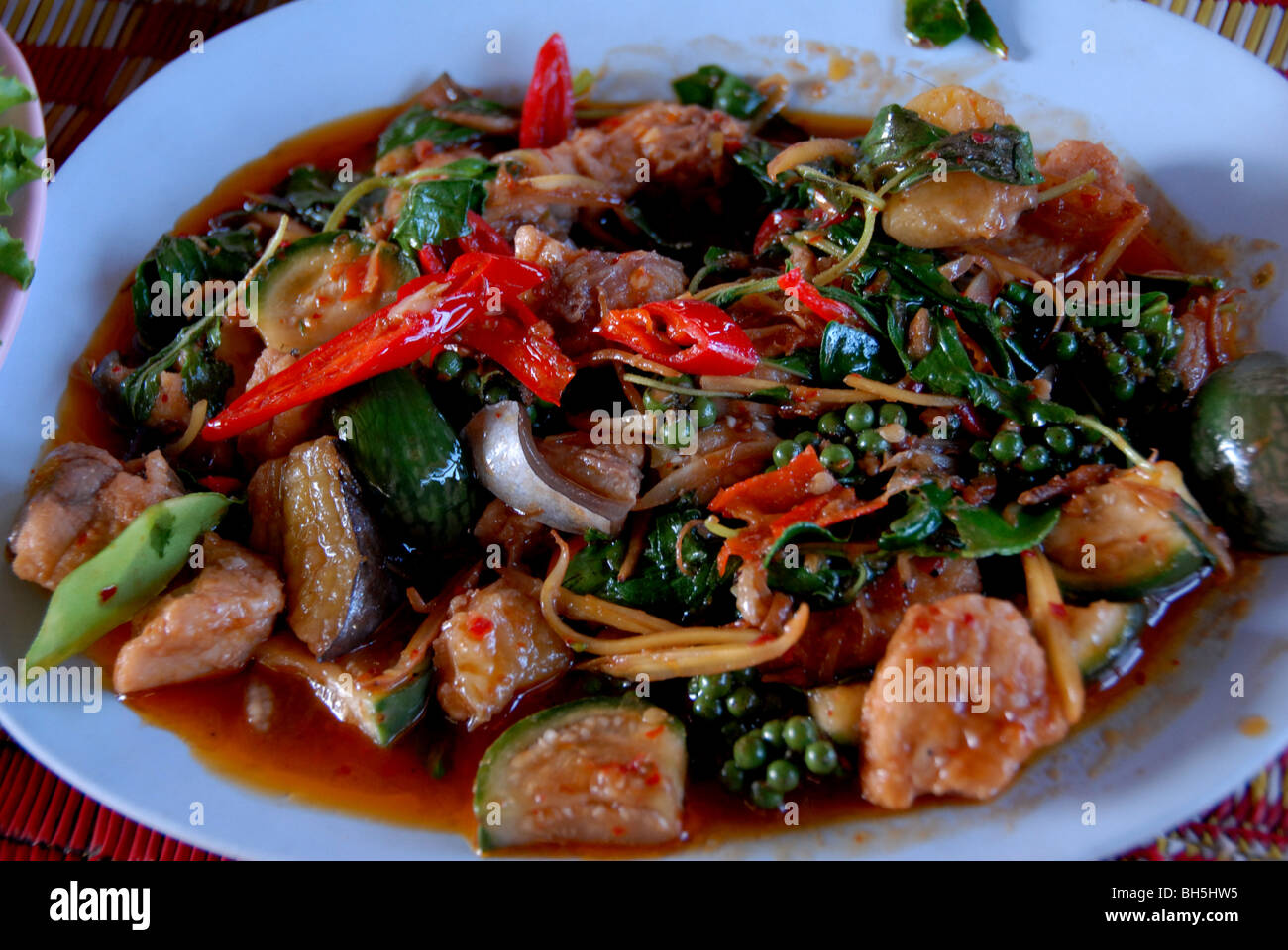 Spicy stir fry wild pork with young thai pepper and basil ( Moo Pad pa ...