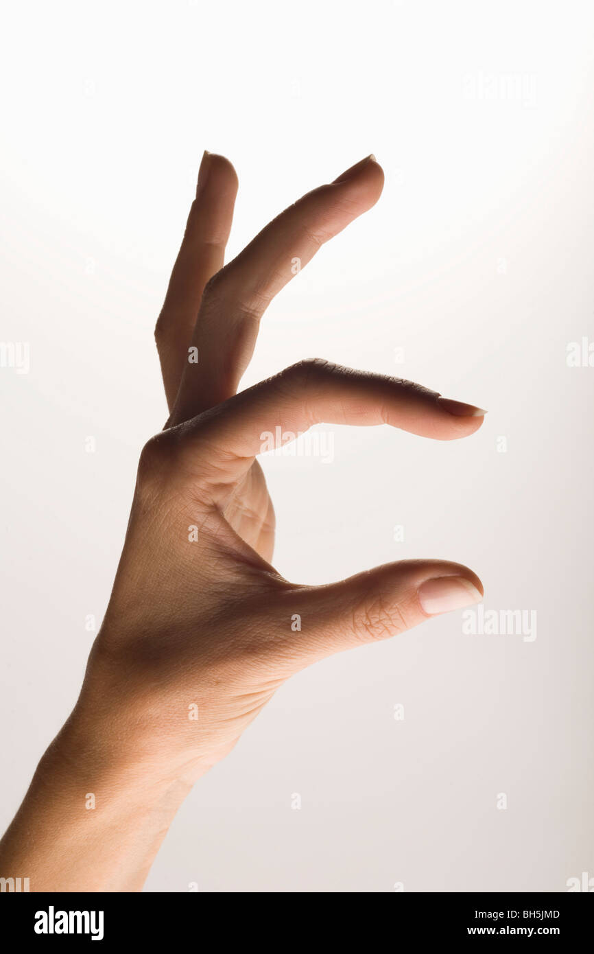 Hand measuring or indicating an object Stock Photo - Alamy