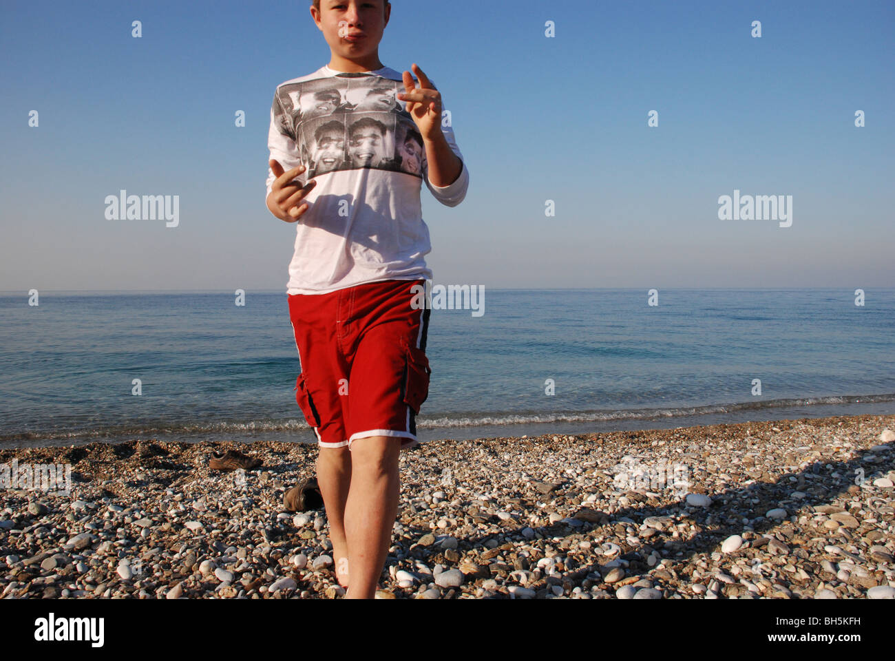 boy dancing on beach Stock Photo - Alamy