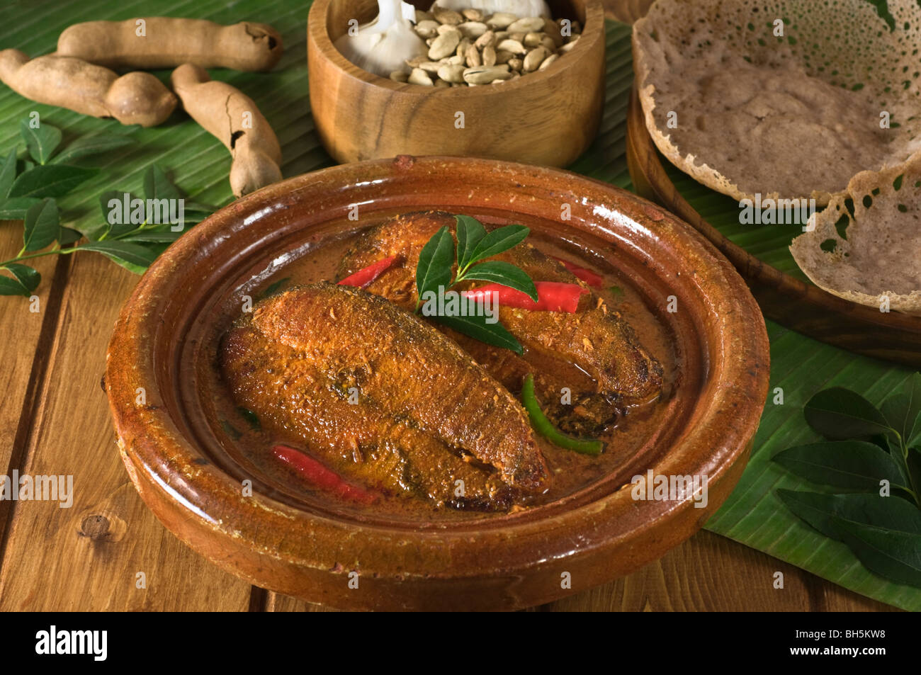 Kerala fish curry with appams South India food Stock Photo - Alamy