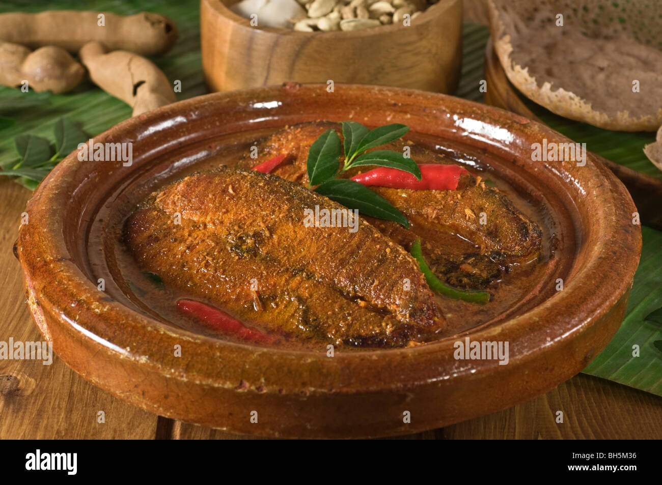Kerala fish curry with appams South India food Stock Photo - Alamy