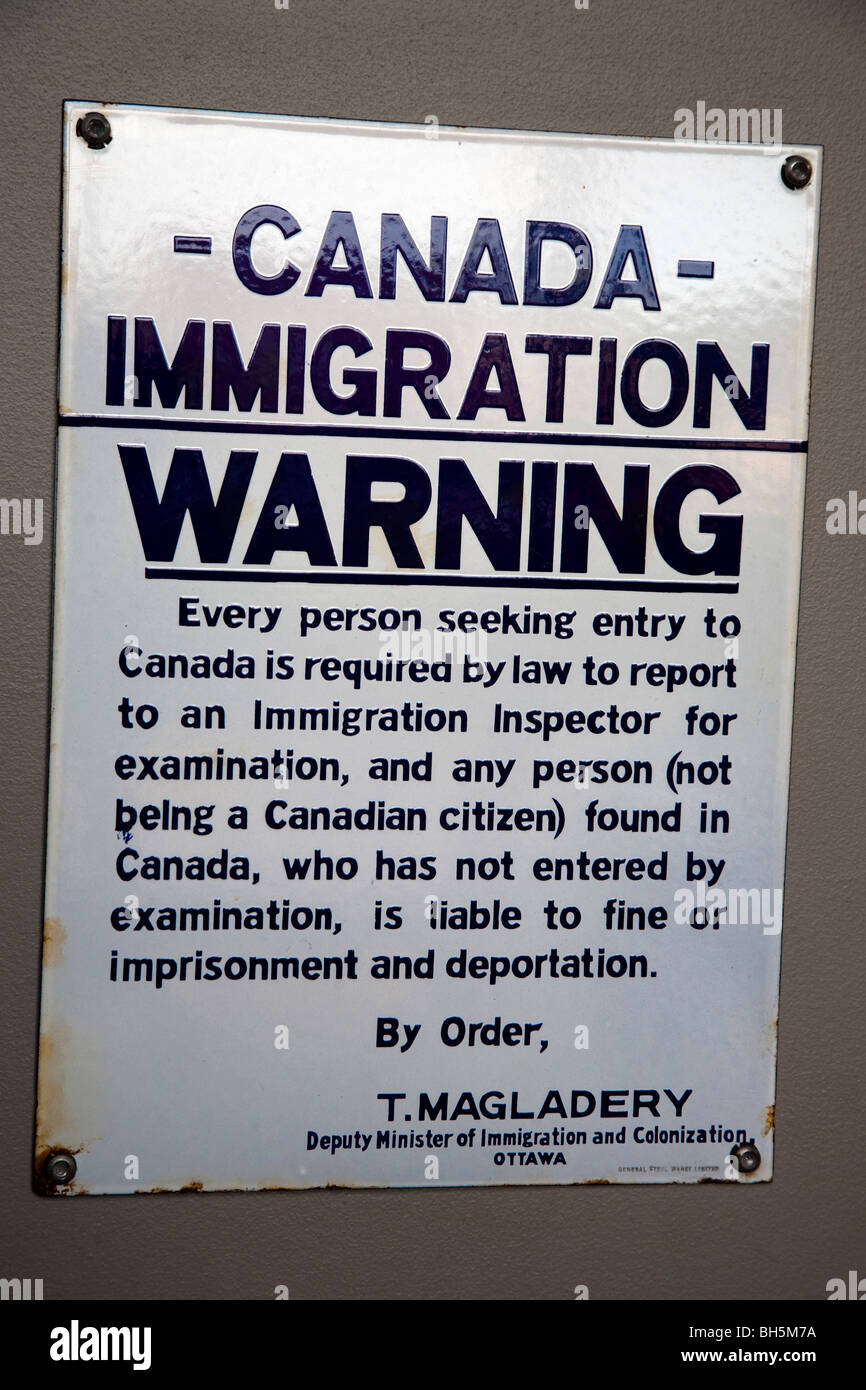 Rusted Canadian immigration warning notice Stock Photo - Alamy