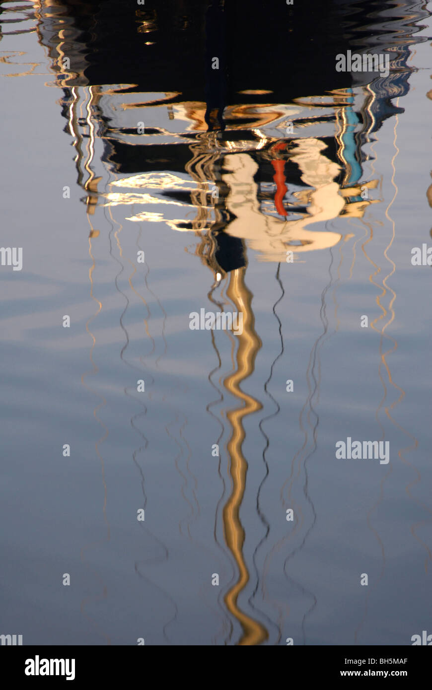 Reflection of sailboat in water Stock Photo - Alamy