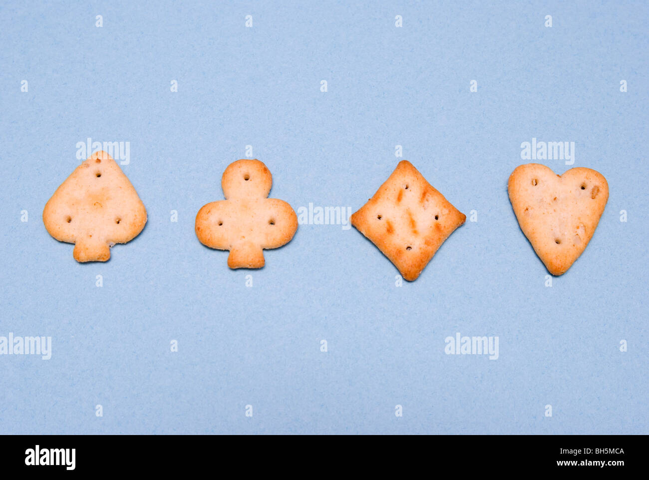salted biscuits with playing card symbols shape Stock Photo - Alamy