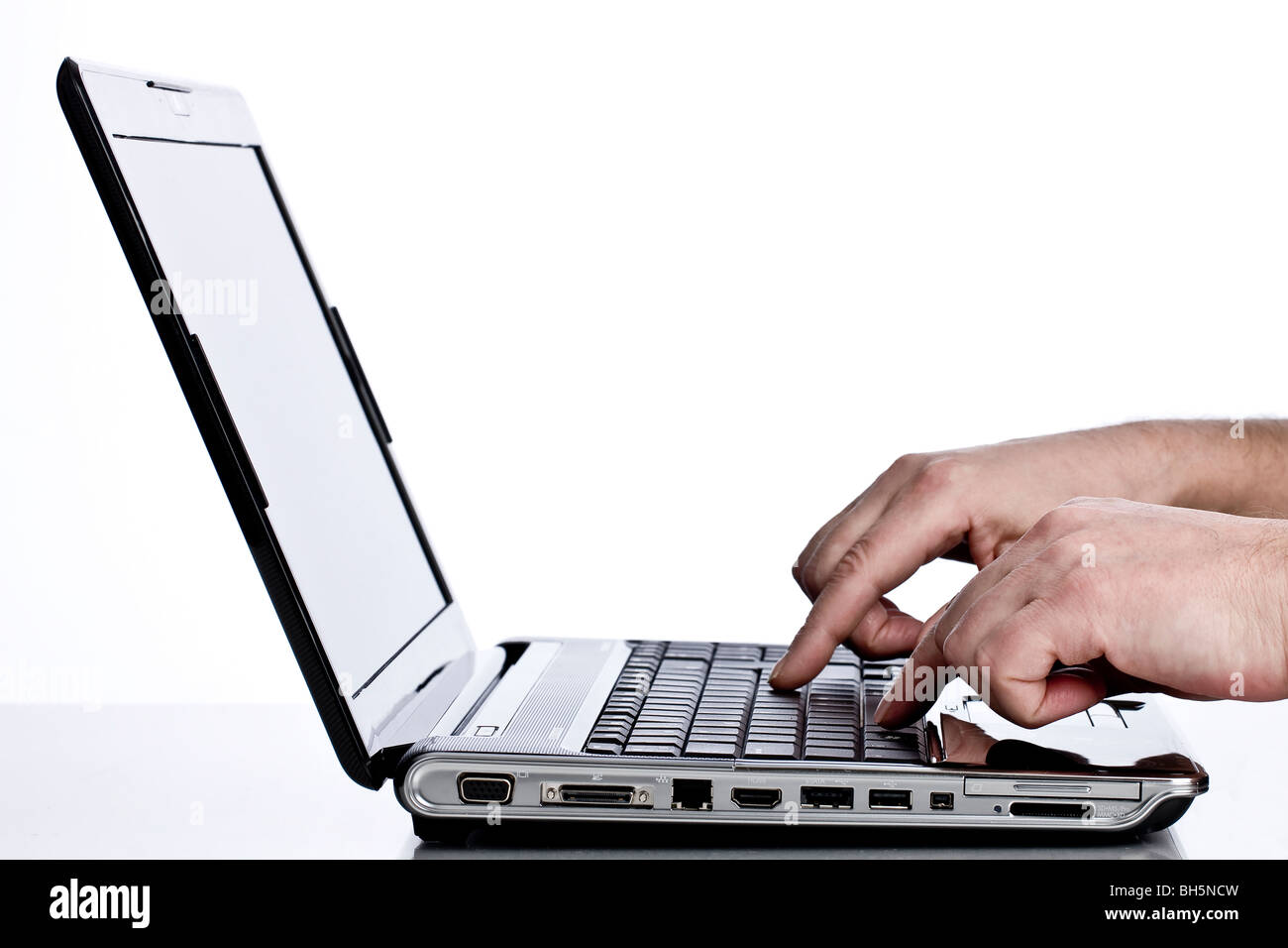 Hands on laptop computer keyboard Stock Photo - Alamy
