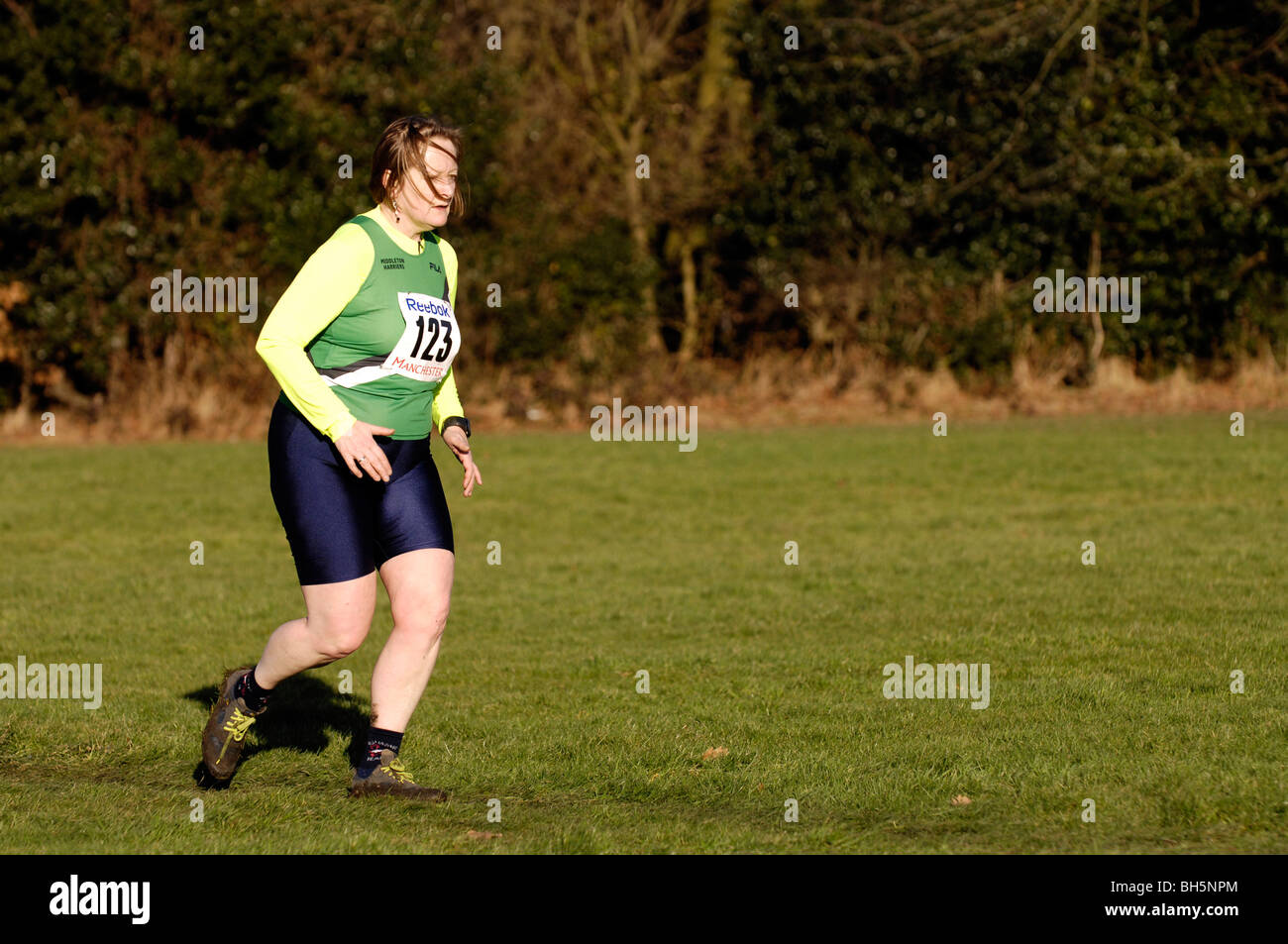 Overweight lady running in a cross-country race Stock Photo - Alamy