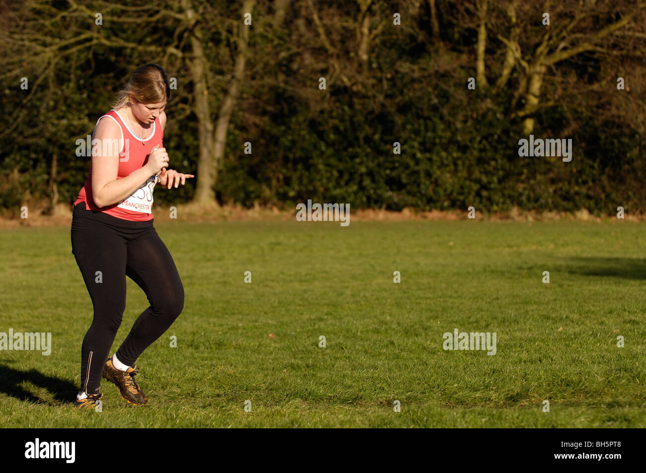 Overweight lady running in a cross-country race Stock Photo - Alamy