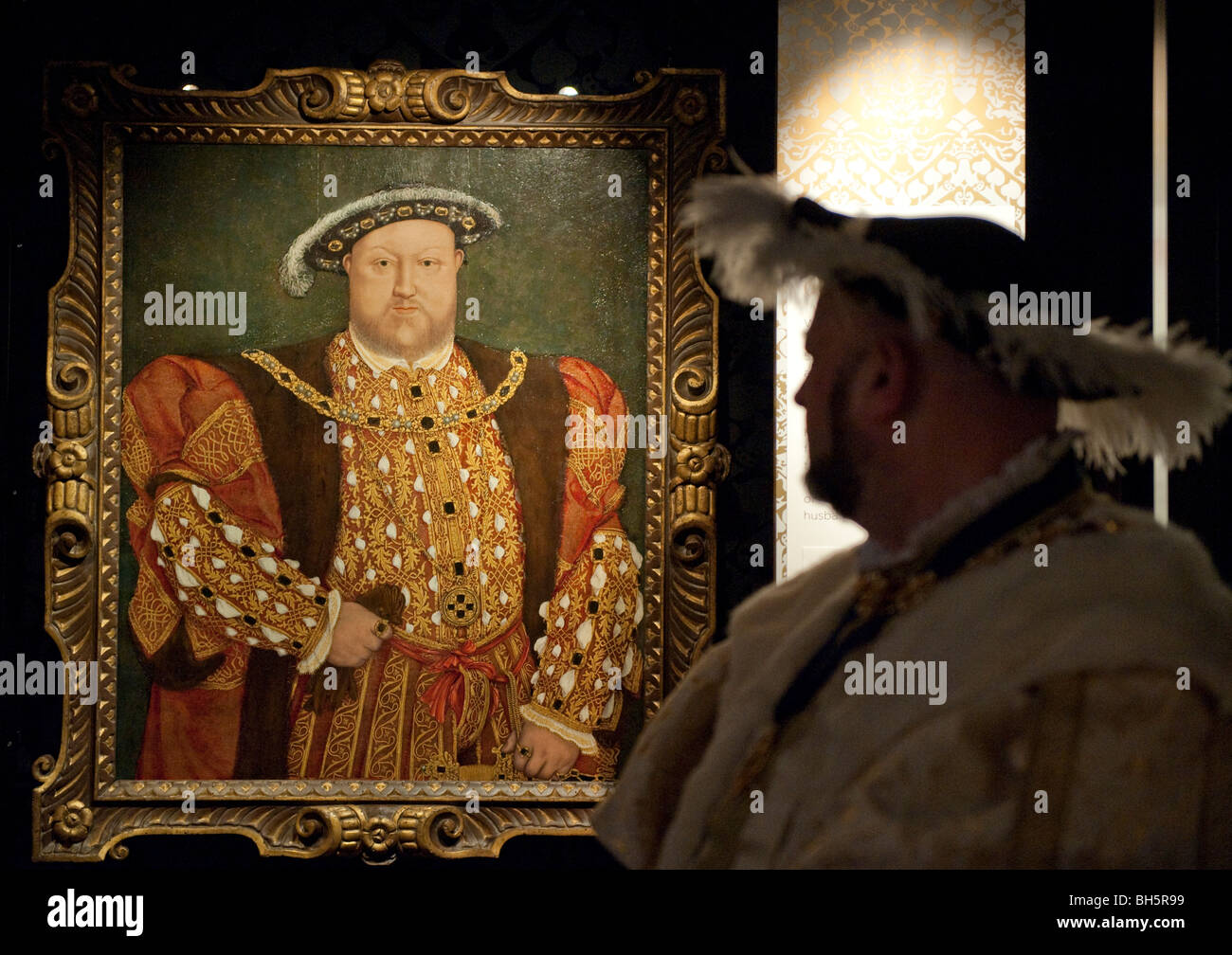 An actor in Henry VIII and Ann Boleyn costume looks at a King's ...