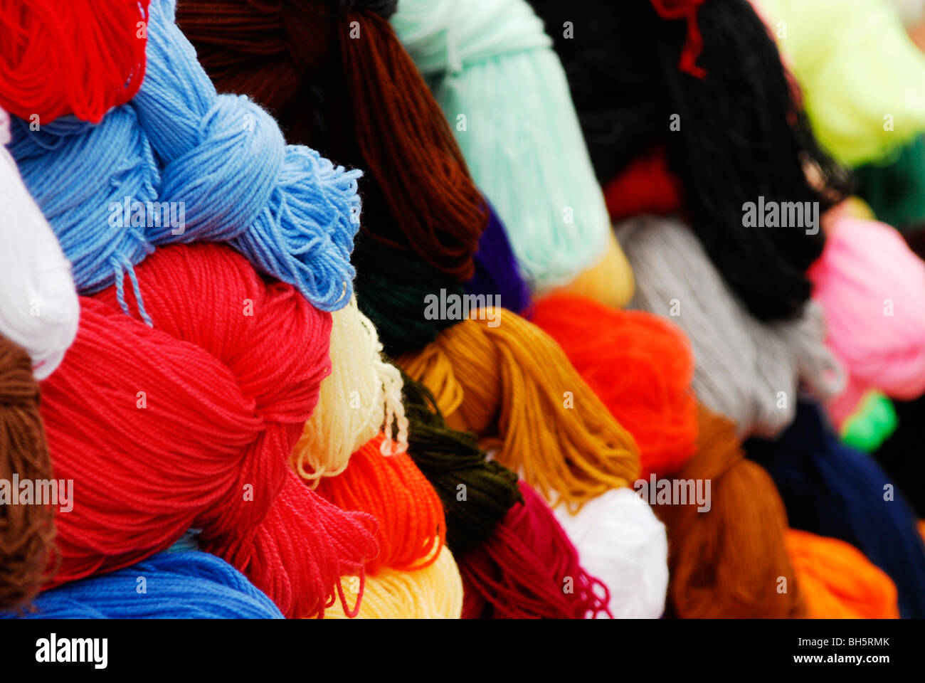 Ecuador, Otavalo, full frame of a stack of colorful wool at a market ...