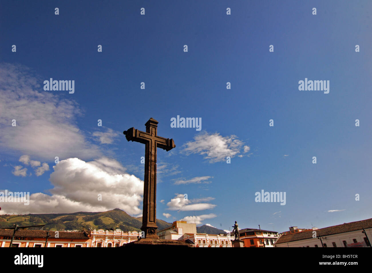 Ecuador, Quito, People sitting on the ground at Quito city square with ...