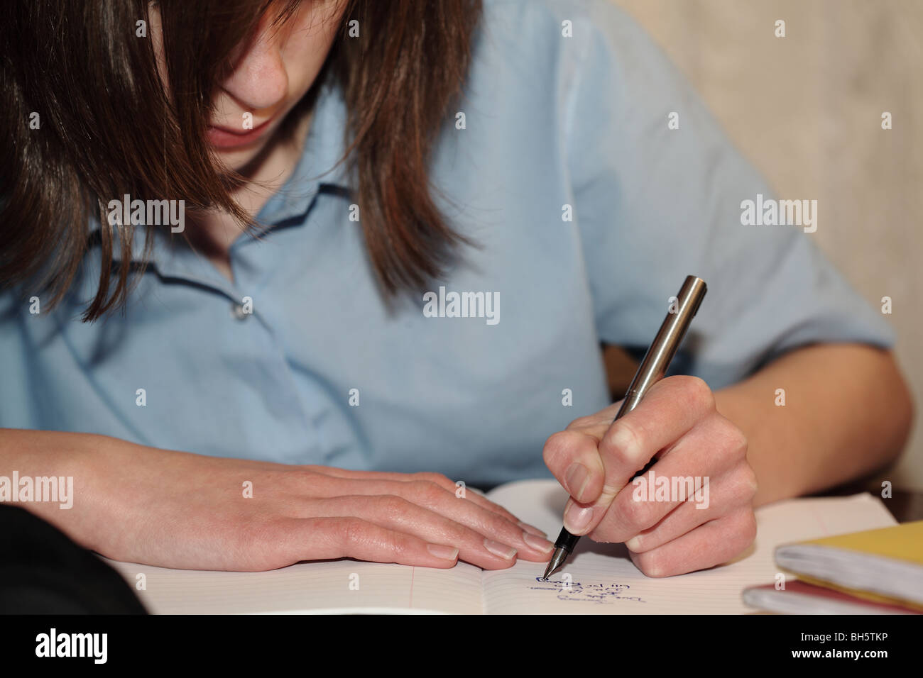 school girl writing Stock Photo - Alamy