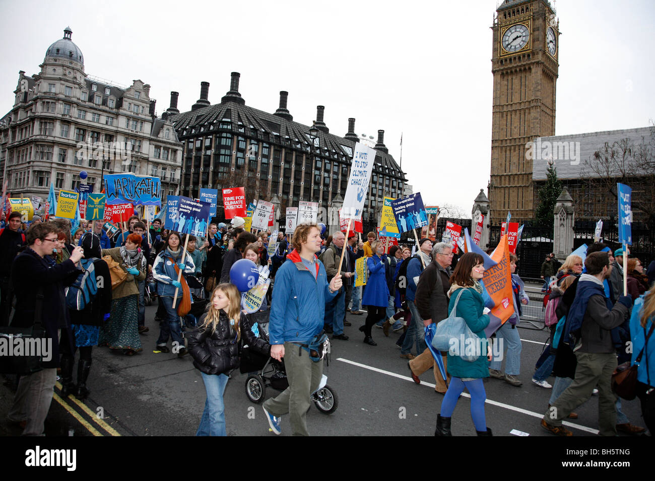 Walking holding demonstration crowd building exterior hi-res stock ...