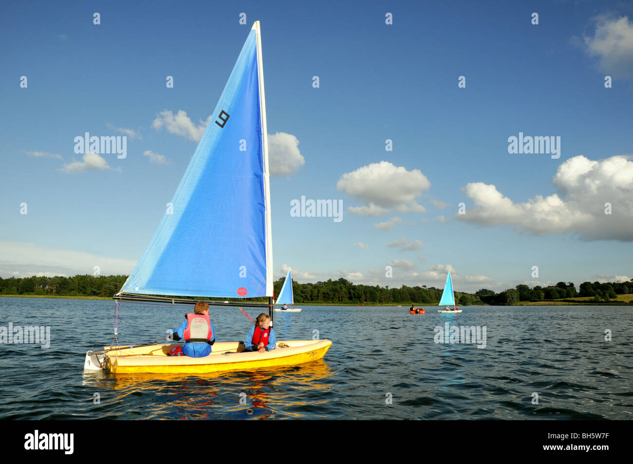CHildren in sailing dingies on a lake, UK Stock Photo - Alamy