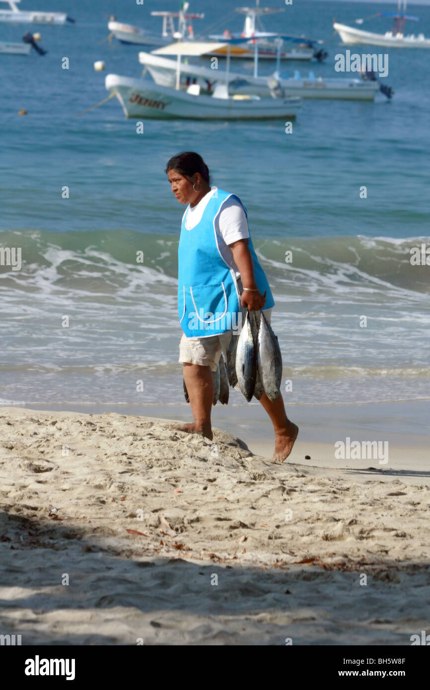 Woman carrying fish hi-res stock photography and images - Alamy