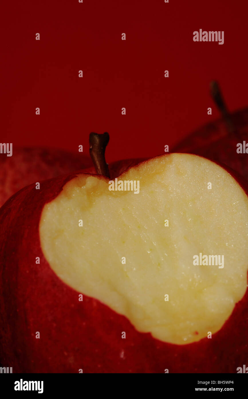 red apple with a bite taken out Stock Photo - Alamy